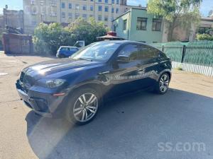 Black BMW X6 2011 in Riga, with an engine capacity of 4.40 L and mileage of 322 thousand km for 9950 €, photo 5 on AUTOMOTO.COM.LV