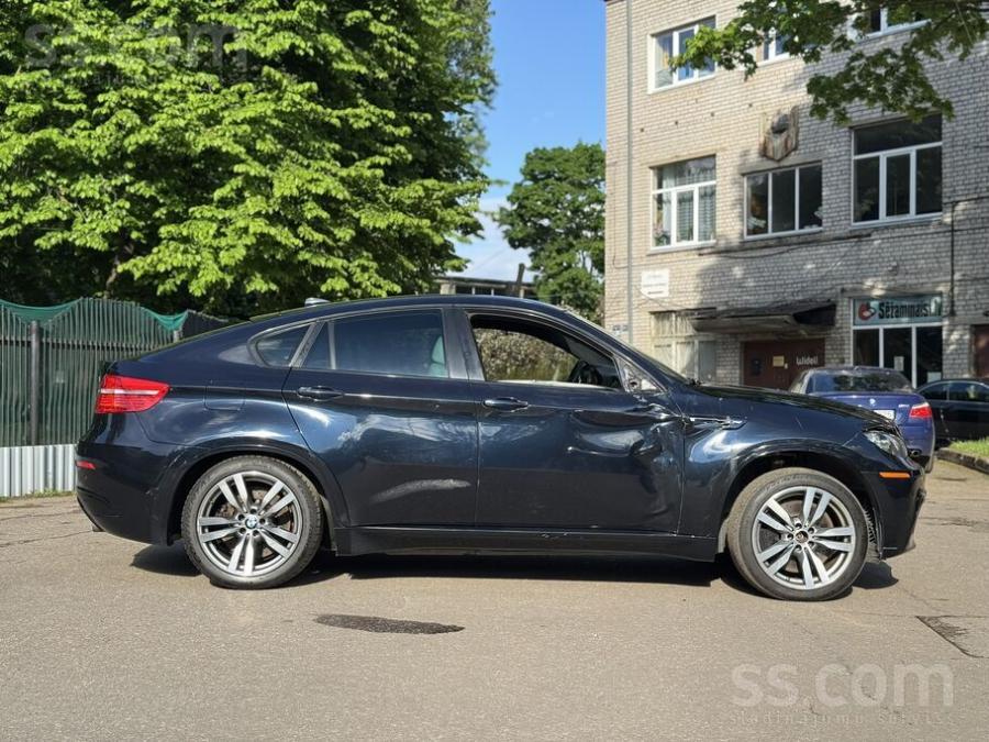 Black BMW X6 2011 in Riga, with an engine capacity of 4.40 L and mileage of 322 thousand km for 9950 €, photo 7 on AUTOMOTO.COM.LV