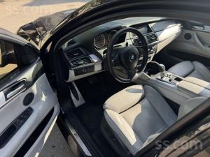 Black BMW X6 2011 in Riga, with an engine capacity of 4.40 L and mileage of 322 thousand km for 9950 €, photo 12 on AUTOMOTO.COM.LV