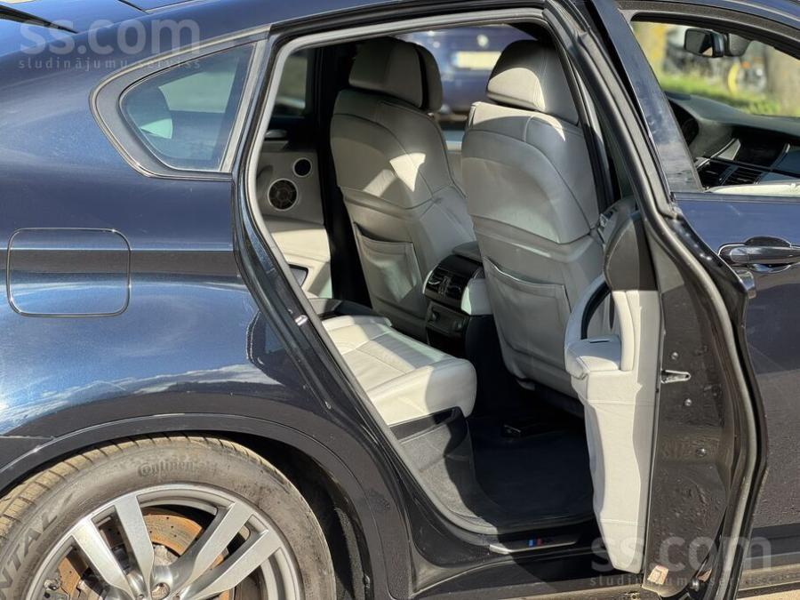 Black BMW X6 2011 in Riga, with an engine capacity of 4.40 L and mileage of 322 thousand km for 9950 €, photo 16 on AUTOMOTO.COM.LV