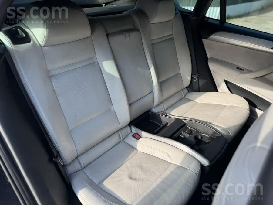 Black BMW X6 2011 in Riga, with an engine capacity of 4.40 L and mileage of 322 thousand km for 9950 €, photo 17 on AUTOMOTO.COM.LV