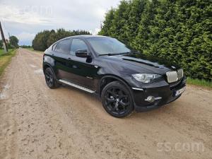 Black BMW X6 2012 in Jelgava, with an engine capacity of 3.00 L and mileage of 257 thousand km for 12800 €, photo 11 on AUTOMOTO.COM.LV