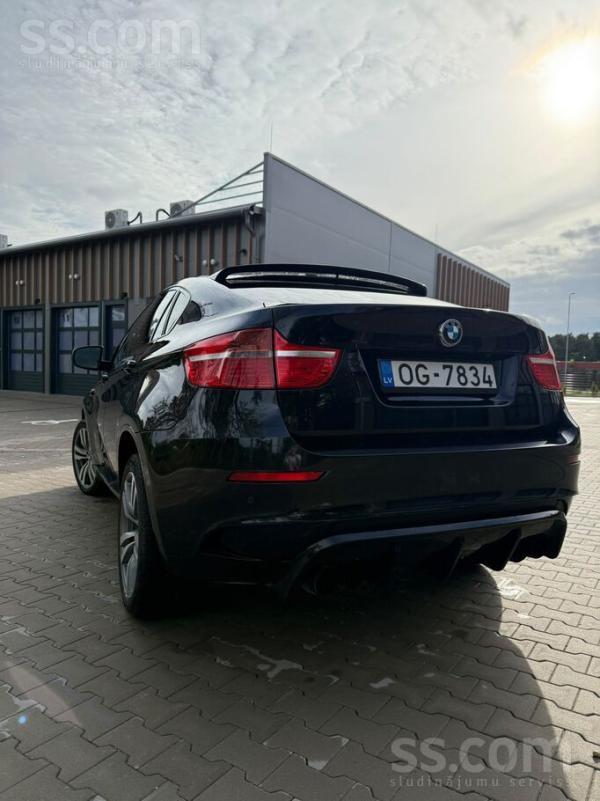 Black BMW X6 2012 in Riga, with an engine capacity of 4.40 L and mileage of 223 thousand km for 14200 €, photo 7 on AUTOMOTO.COM.LV