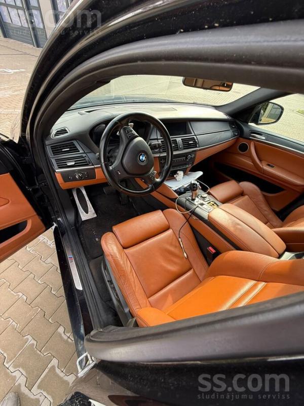 Black BMW X6 2012 in Riga, with an engine capacity of 4.40 L and mileage of 223 thousand km for 14200 €, photo 11 on AUTOMOTO.COM.LV