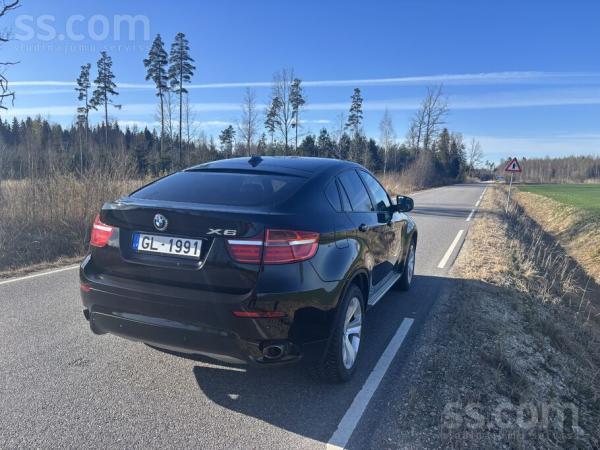 Black BMW X6 2014 in Ogre, with an engine capacity of 3.00 L and mileage of 212 thousand km for 13700 €, photo 8 on AUTOMOTO.COM.LV