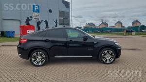 Black BMW X6 2014 in Riga, with an engine capacity of 3.00 L and mileage of 199 thousand km for 16500 €, photo 26 on AUTOMOTO.COM.LV