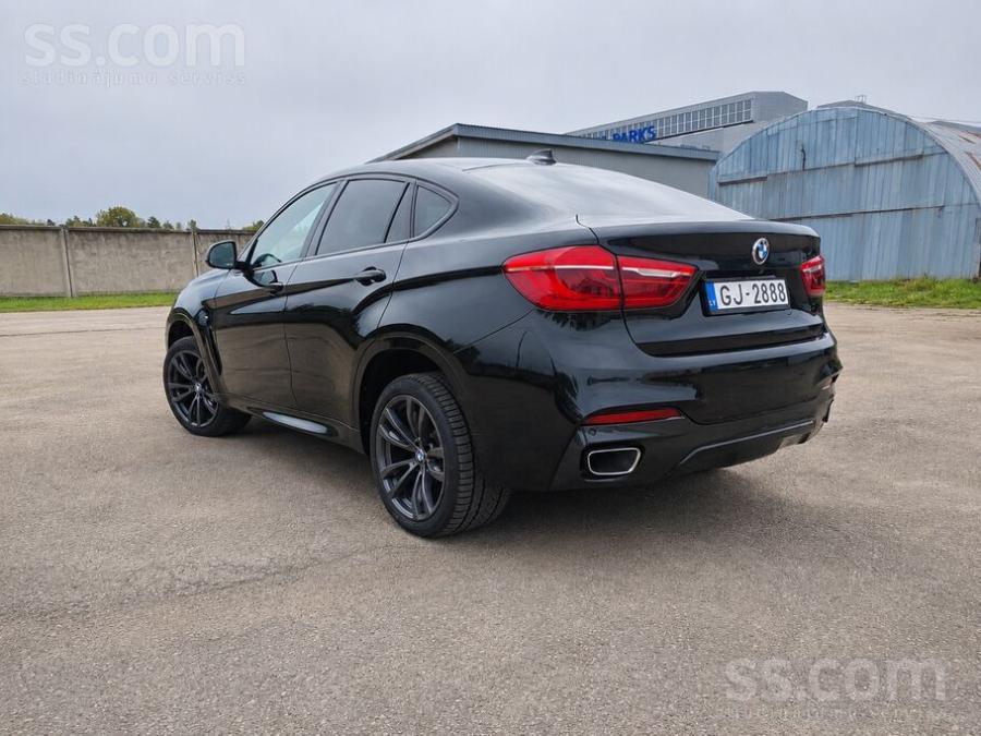 Black BMW X6 2015 in Riga, with an engine capacity of 3.00 L and mileage of 204 thousand km for 26000 €, photo 4 on AUTOMOTO.COM.LV