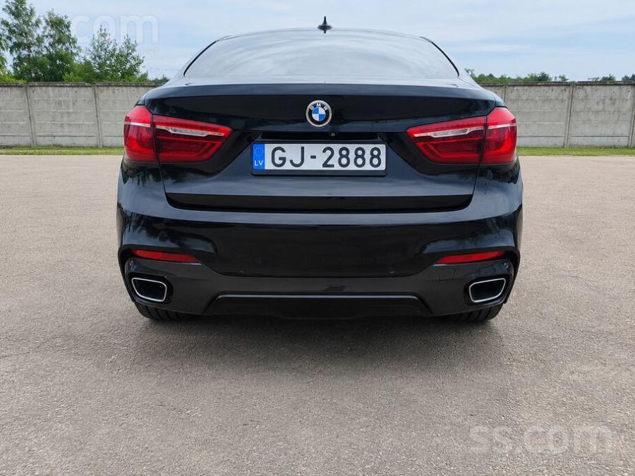 Black BMW X6 2015 in Riga, with an engine capacity of 3.00 L and mileage of 204 thousand km for 26000 €, photo 6 on AUTOMOTO.COM.LV