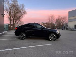 Black BMW X6 2015 in Riga, with an engine capacity of 3.00 L and mileage of 149 thousand km for 30900 €, photo 5 on AUTOMOTO.COM.LV