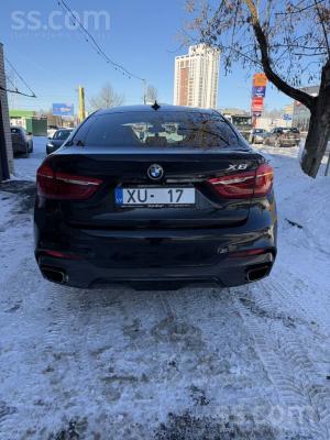 Black BMW X6 2015 in Riga, with an engine capacity of 3.00 L and mileage of 0 thousand km for 21500 €, photo 4 on AUTOMOTO.COM.LV