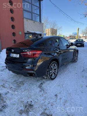 Black BMW X6 2015 in Riga, with an engine capacity of 3.00 L and mileage of 0 thousand km for 21500 €, photo 5 on AUTOMOTO.COM.LV