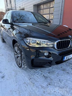 Black BMW X6 2015 in Riga, with an engine capacity of 3.00 L and mileage of 0 thousand km for 21500 €, photo 7 on AUTOMOTO.COM.LV