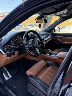 Black BMW X6 2015 in Riga, with an engine capacity of 3.00 L and mileage of 0 thousand km for 21500 €, photo 9 on AUTOMOTO.COM.LV