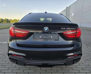 Black BMW X6 2015 in Panevezys, with an engine capacity of 2.99 L and mileage of 313 thousand km for 22999 €, photo 6 on AUTOMOTO.COM.LV