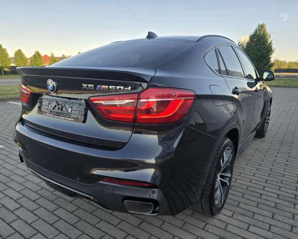 Black BMW X6 2015 in Panevezys, with an engine capacity of 2.99 L and mileage of 313 thousand km for 22999 €, photo 6 on AUTOMOTO.COM.LV
