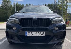 Black BMW X6 2015 in Riga, with an engine capacity of 3.00 L and mileage of 211 thousand km for 22300 €, photo 3 on AUTOMOTO.COM.LV
