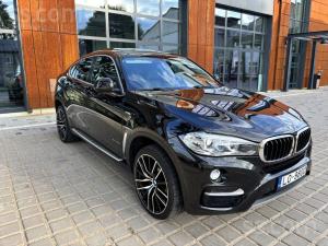Black BMW X6 2015 in Riga, with an engine capacity of 3.00 L and mileage of 221 thousand km for 23900 €, photo 4 on AUTOMOTO.COM.LV