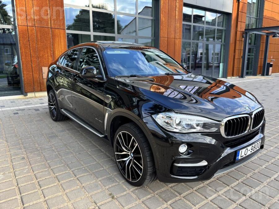 Black BMW X6 2015 in Riga, with an engine capacity of 3.00 L and mileage of 221 thousand km for 23900 €, photo 4 on AUTOMOTO.COM.LV