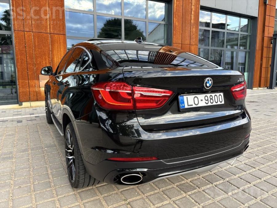 Black BMW X6 2015 in Riga, with an engine capacity of 3.00 L and mileage of 221 thousand km for 23900 €, photo 5 on AUTOMOTO.COM.LV