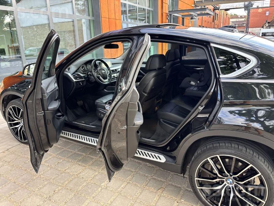 Black BMW X6 2015 in Riga, with an engine capacity of 3.00 L and mileage of 221 thousand km for 23900 €, photo 6 on AUTOMOTO.COM.LV