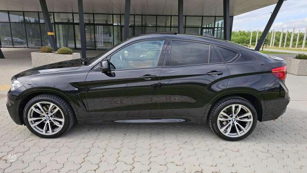 Black BMW X6 2015 in Kaunas, with an engine capacity of 2.99 L and mileage of 229 thousand km for 23490 €, photo 4 on AUTOMOTO.COM.LV