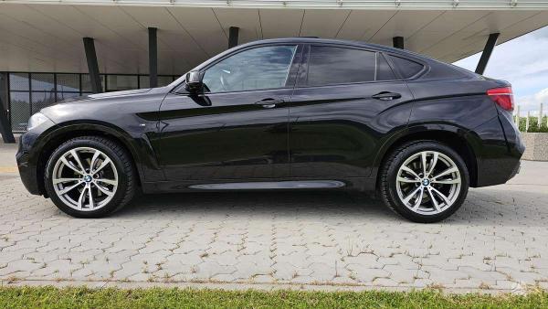 Black BMW X6 2015 in Kaunas, with an engine capacity of 2.99 L and mileage of 229 thousand km for 23490 €, photo 5 on AUTOMOTO.COM.LV