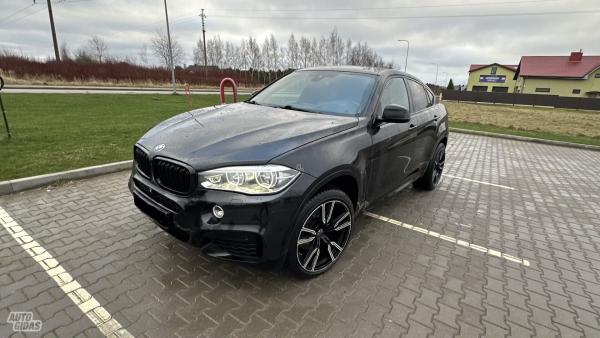 Black BMW X6 2016 in Vilnius, with an engine capacity of 3.00 L and mileage of 196 thousand km for 24400 €, photo 4 on AUTOMOTO.COM.LV
