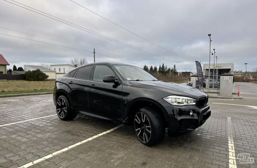 Black BMW X6 2016 in Vilnius, with an engine capacity of 3.00 L and mileage of 196 thousand km for 24400 €, photo 14 on AUTOMOTO.COM.LV