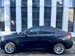 Black BMW X6 2016 in Vilnius, with an engine capacity of 2.99 L and mileage of 261 thousand km for 23999 €, photo 6 on AUTOMOTO.COM.LV
