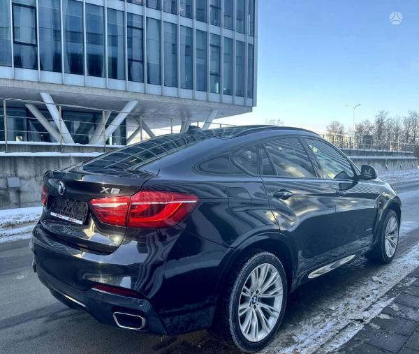 Black BMW X6 2016 in Vilnius, with an engine capacity of 2.99 L and mileage of 261 thousand km for 23999 €, photo 7 on AUTOMOTO.COM.LV