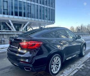 Black BMW X6 2016 in Vilnius, with an engine capacity of 2.99 L and mileage of 261 thousand km for 23999 €, photo 7 on AUTOMOTO.COM.LV