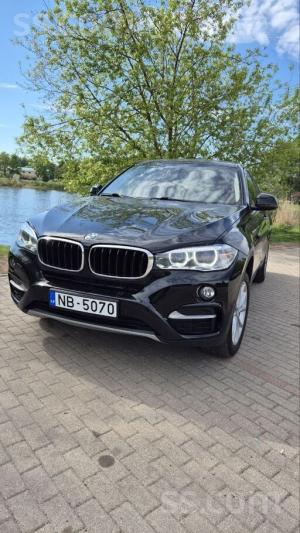Black BMW X6 2016 in Riga, with an engine capacity of 3.00 L and mileage of 135 thousand km for 29900 €, photo  on AUTOMOTO.COM.LV