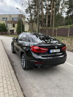 Black BMW X6 2016 in Riga, with an engine capacity of 3.00 L and mileage of 146 thousand km for 22000 €, photo 4 on AUTOMOTO.COM.LV