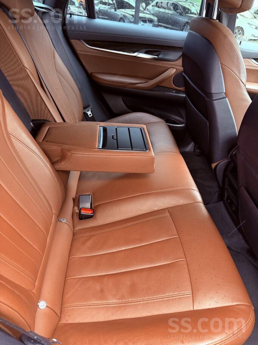 Black BMW X6 2016 in Riga, with an engine capacity of 3.00 L and mileage of 146 thousand km for 22000 €, photo 7 on AUTOMOTO.COM.LV