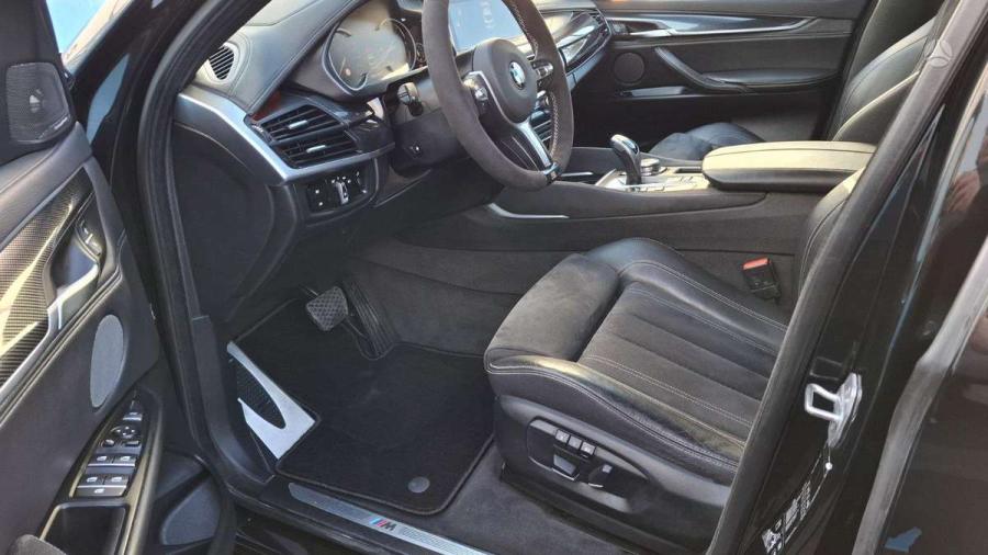 Black BMW X6 2016 in Kaunas, with an engine capacity of 2.99 L and mileage of 269 thousand km for 23900 €, photo 6 on AUTOMOTO.COM.LV