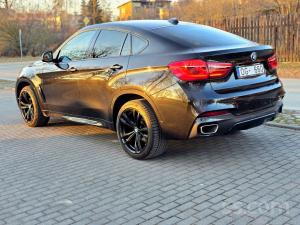 Black BMW X6 2016 in Ogre, with an engine capacity of 3.00 L and mileage of 221 thousand km for 28000 €, photo 6 on AUTOMOTO.COM.LV