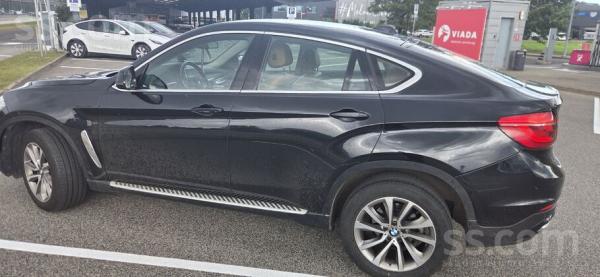 Black BMW X6 2016 in Riga, with an engine capacity of 3.00 L and mileage of 253 thousand km for 20200 €, photo 3 on AUTOMOTO.COM.LV