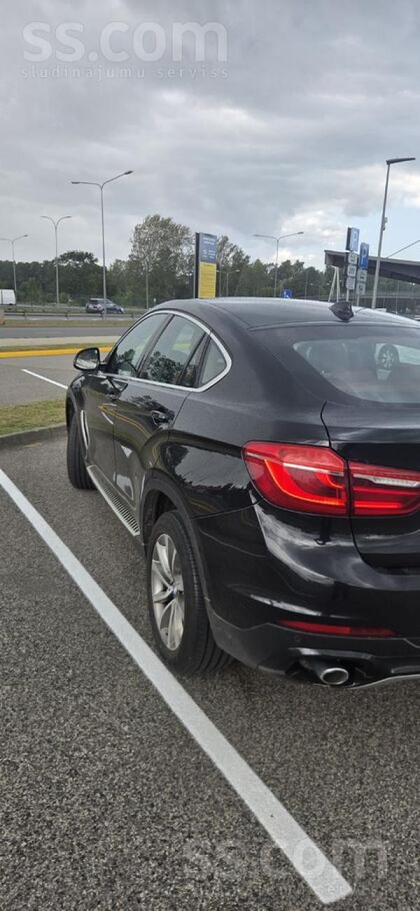 Black BMW X6 2016 in Riga, with an engine capacity of 3.00 L and mileage of 253 thousand km for 20200 €, photo 4 on AUTOMOTO.COM.LV