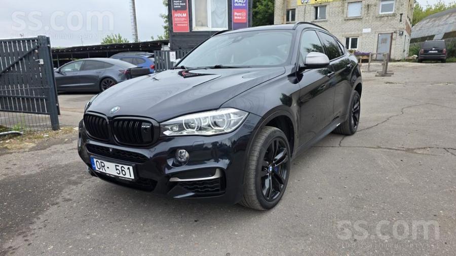 Black BMW X6 2016 in Riga, with an engine capacity of 3.00 L and mileage of 181 thousand km for 23990 €, photo 5 on AUTOMOTO.COM.LV