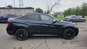 Black BMW X6 2016 in Riga, with an engine capacity of 3.00 L and mileage of 181 thousand km for 23990 €, photo 6 on AUTOMOTO.COM.LV