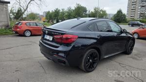 Black BMW X6 2016 in Riga, with an engine capacity of 3.00 L and mileage of 181 thousand km for 23990 €, photo 7 on AUTOMOTO.COM.LV
