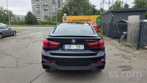 Black BMW X6 2016 in Riga, with an engine capacity of 3.00 L and mileage of 181 thousand km for 23990 €, photo 8 on AUTOMOTO.COM.LV