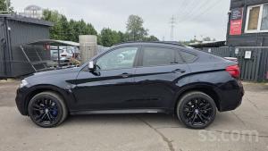 Black BMW X6 2016 in Riga, with an engine capacity of 3.00 L and mileage of 181 thousand km for 23990 €, photo 9 on AUTOMOTO.COM.LV