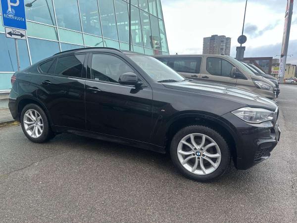 Black BMW X6 2017 in Vilnius, with an engine capacity of 2.99 L and mileage of 244 thousand km for 25490 €, photo 4 on AUTOMOTO.COM.LV