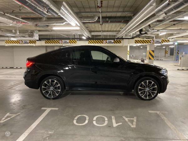 Black BMW X6 2017 in Vilnius, with an engine capacity of 3.00 L and mileage of 136 thousand km for 35490 €, photo 2 on AUTOMOTO.COM.LV