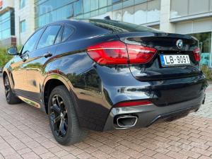 Black BMW X6 2017 in Riga, with an engine capacity of 3.00 L and mileage of 0 thousand km for 23500 €, photo 11 on AUTOMOTO.COM.LV