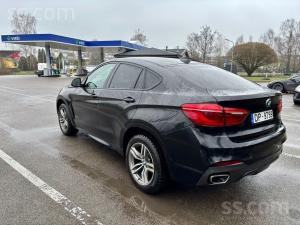 Black BMW X6 2018 in Riga, with an engine capacity of 3.00 L and mileage of 120 thousand km for 15500 €, photo 4 on AUTOMOTO.COM.LV