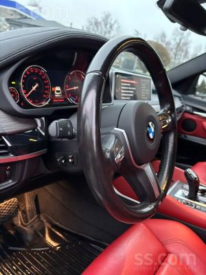 Black BMW X6 2018 in Riga, with an engine capacity of 3.00 L and mileage of 120 thousand km for 15500 €, photo 16 on AUTOMOTO.COM.LV