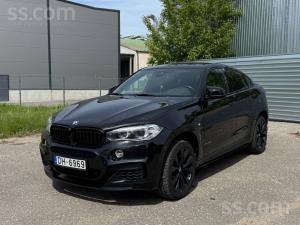 Black BMW X6 2018 in Riga, with an engine capacity of 3.00 L and mileage of 137 thousand km for 29699 €, photo 4 on AUTOMOTO.COM.LV