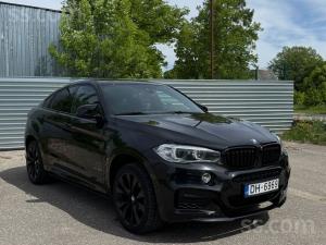 Black BMW X6 2018 in Riga, with an engine capacity of 3.00 L and mileage of 137 thousand km for 29699 €, photo 6 on AUTOMOTO.COM.LV